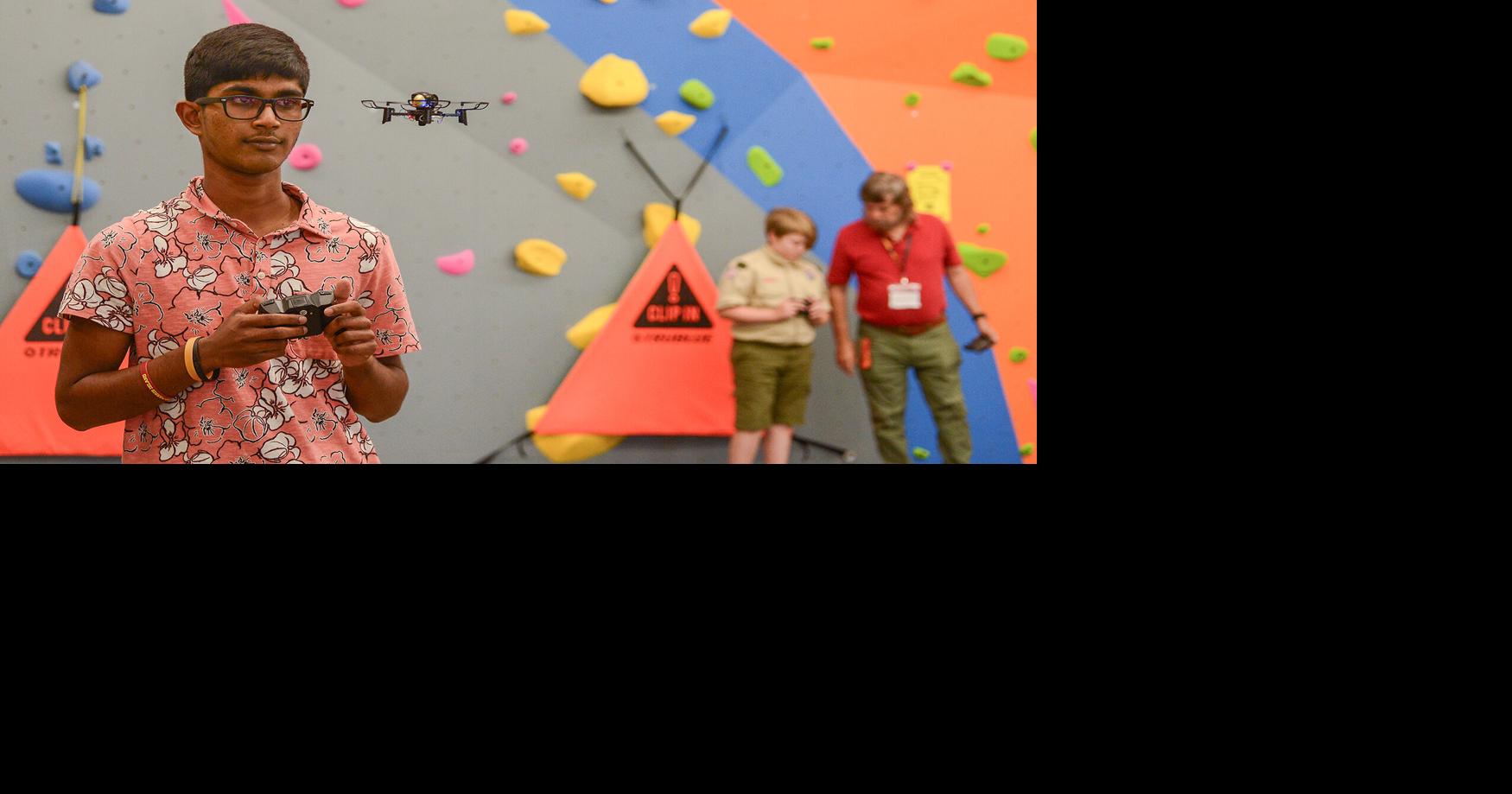 From left, Joseph Cherian flies his newly built drone, while Jamison ...