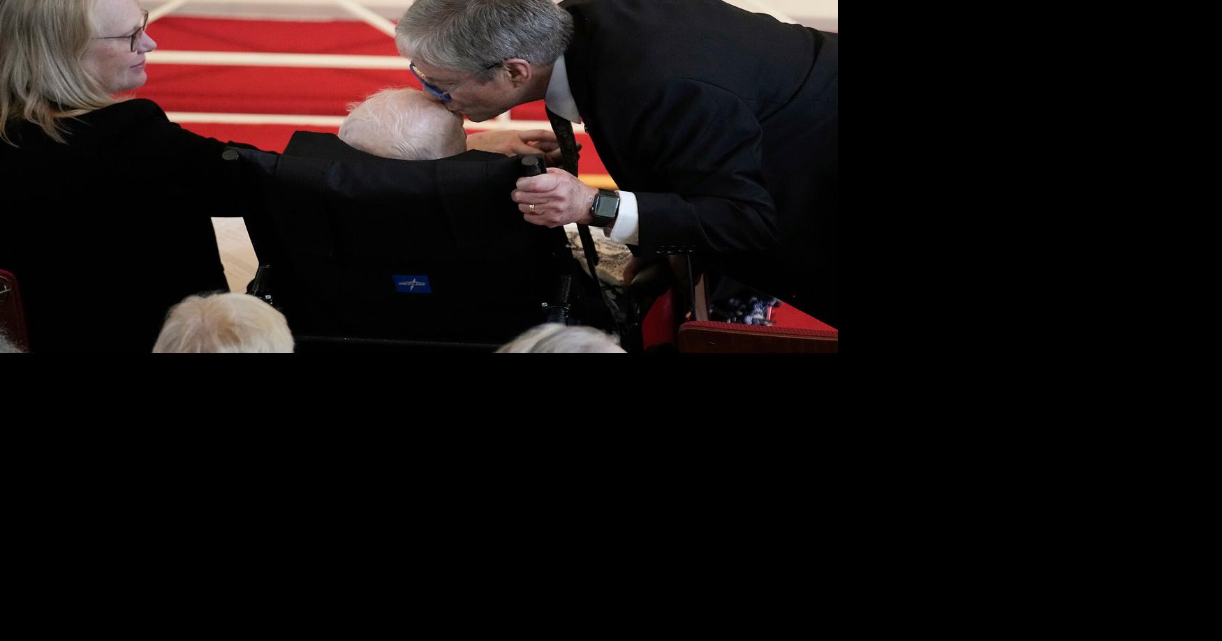 James "Chip" Carter kisses his father, former President Jimmy Carter ...