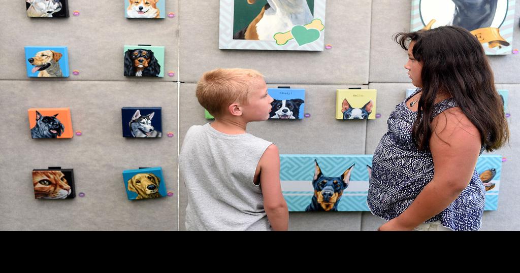 Kayden Ford and his sister Kyra gaze at canine portraits | Photos ...
