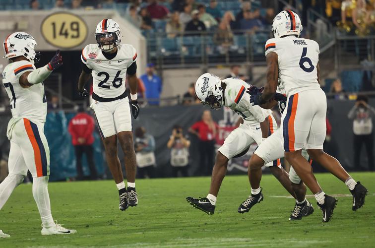 Taste of its own medicine: Virginia grinds out Gator Bowl win over ...