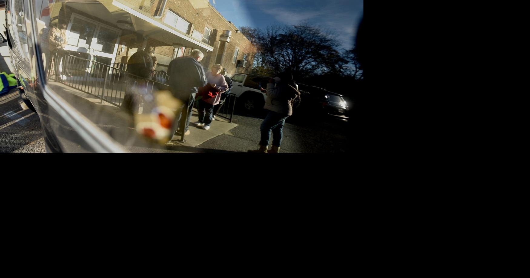 People wait outside the front doors for dinner | | columbiamissourian.com