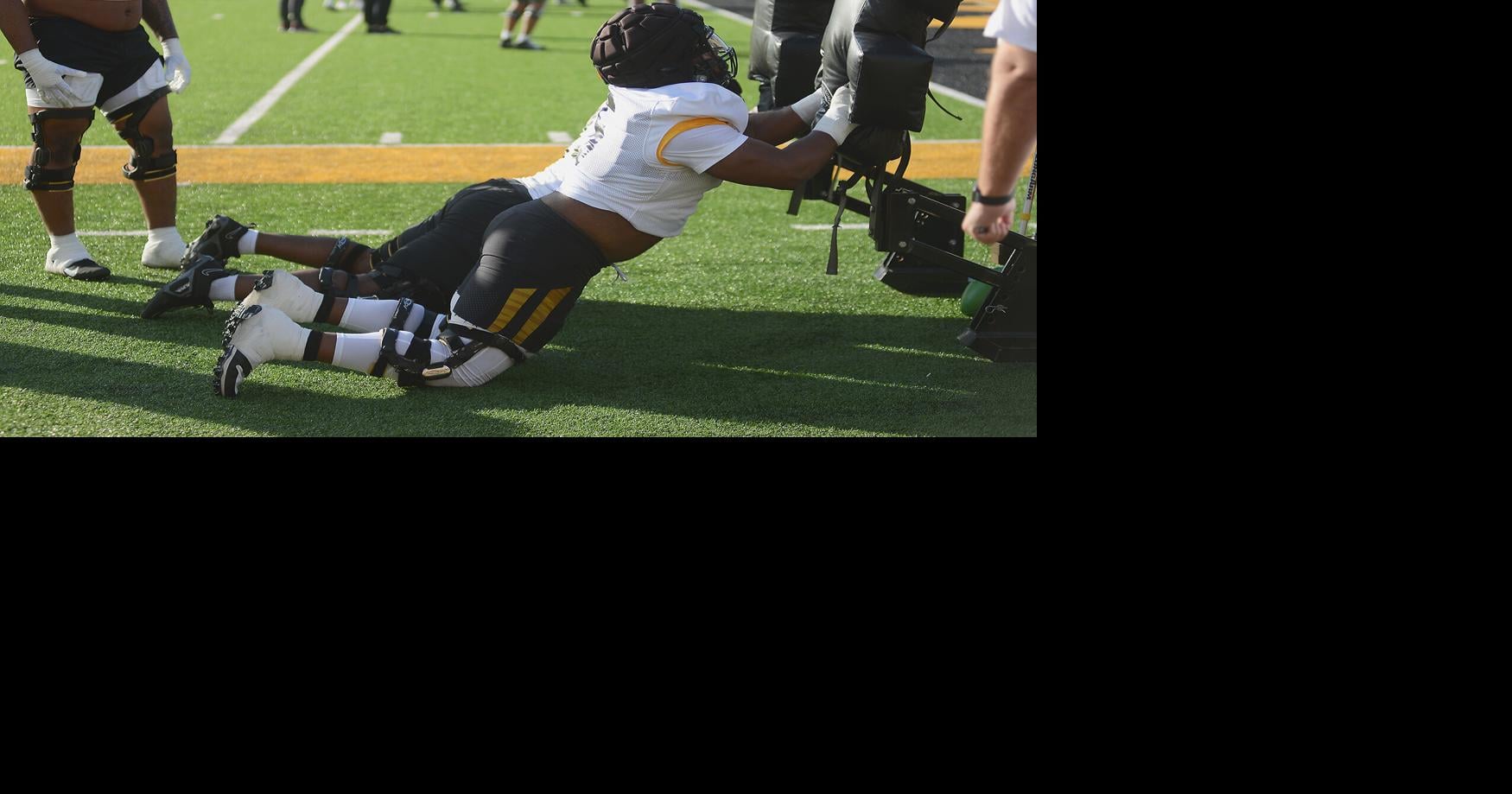 Returning defensive lineman, Kristian Williams, completes a blocking ...