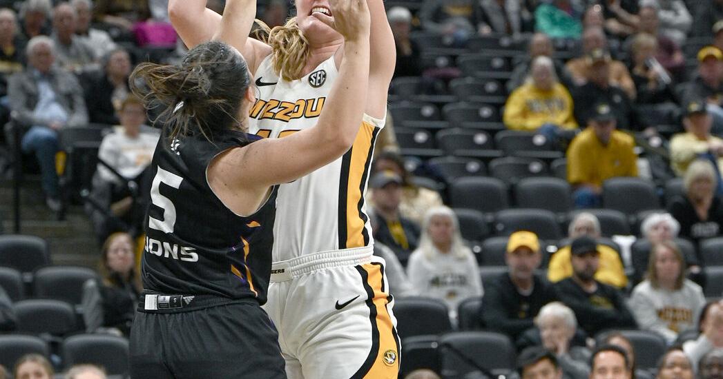 Mizzou forward Hayley Frank fires a short range jumper over North ...