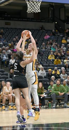Mizzou forward Hayley Frank fires a short range jumper over North ...