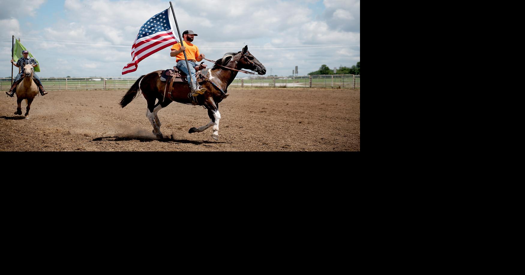 Troy Perkins carries an American flag across | Special Sections ...