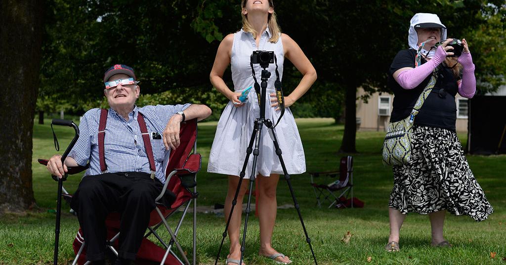 David Fleisher, Diana Fleisher and Carol Fleisher watch the solar ...