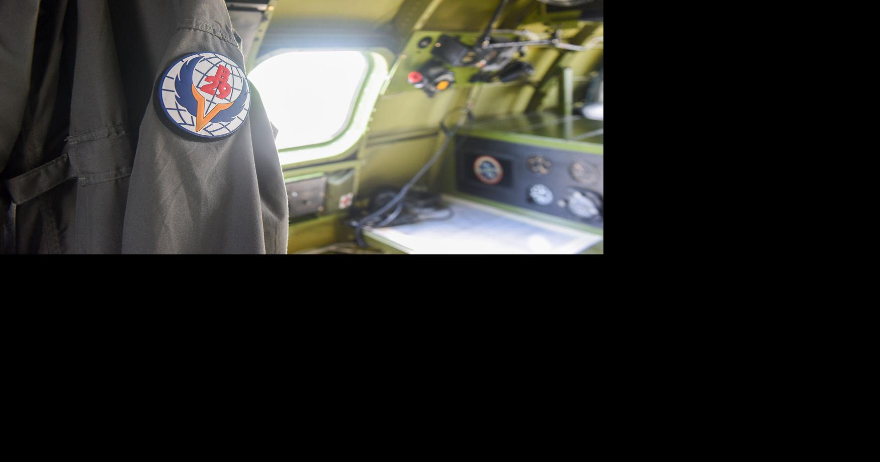 An official aviation jacket of the B-29 bomber “Doc” hangs behind the ...