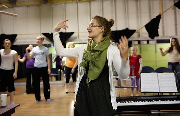Music teacher jumps through hoops to teach students piano and voice ...