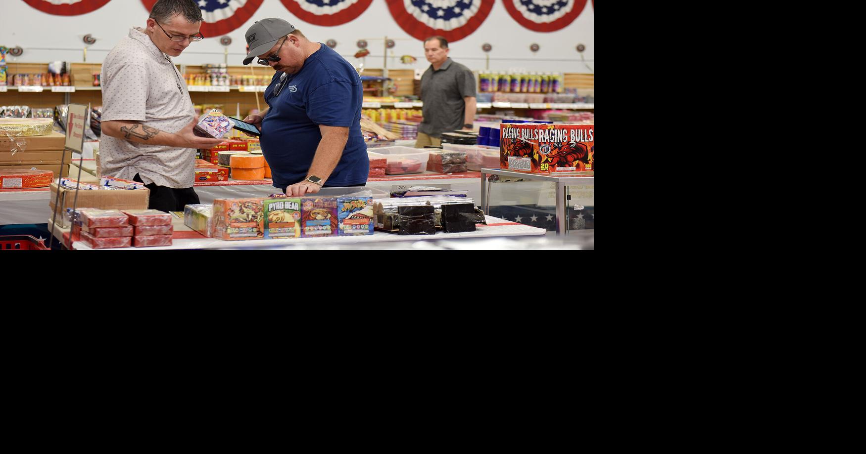 Justin Renshaw, left, and Philip Hines buy fireworks Monday | Visuals | columbiamissourian.com