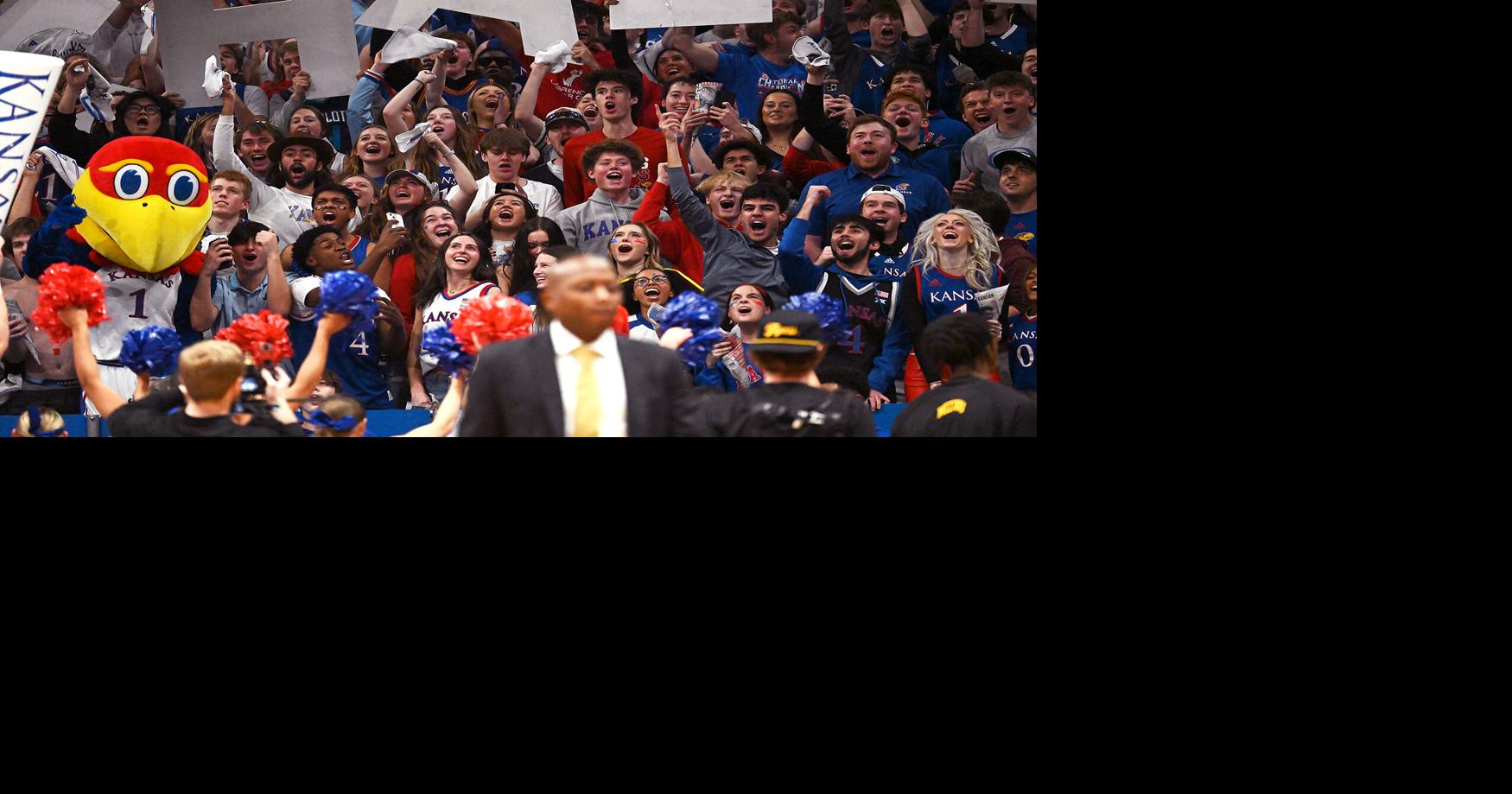 Mizzou men's basketball coach Dennis Gates stands behind a crowd of KU ...