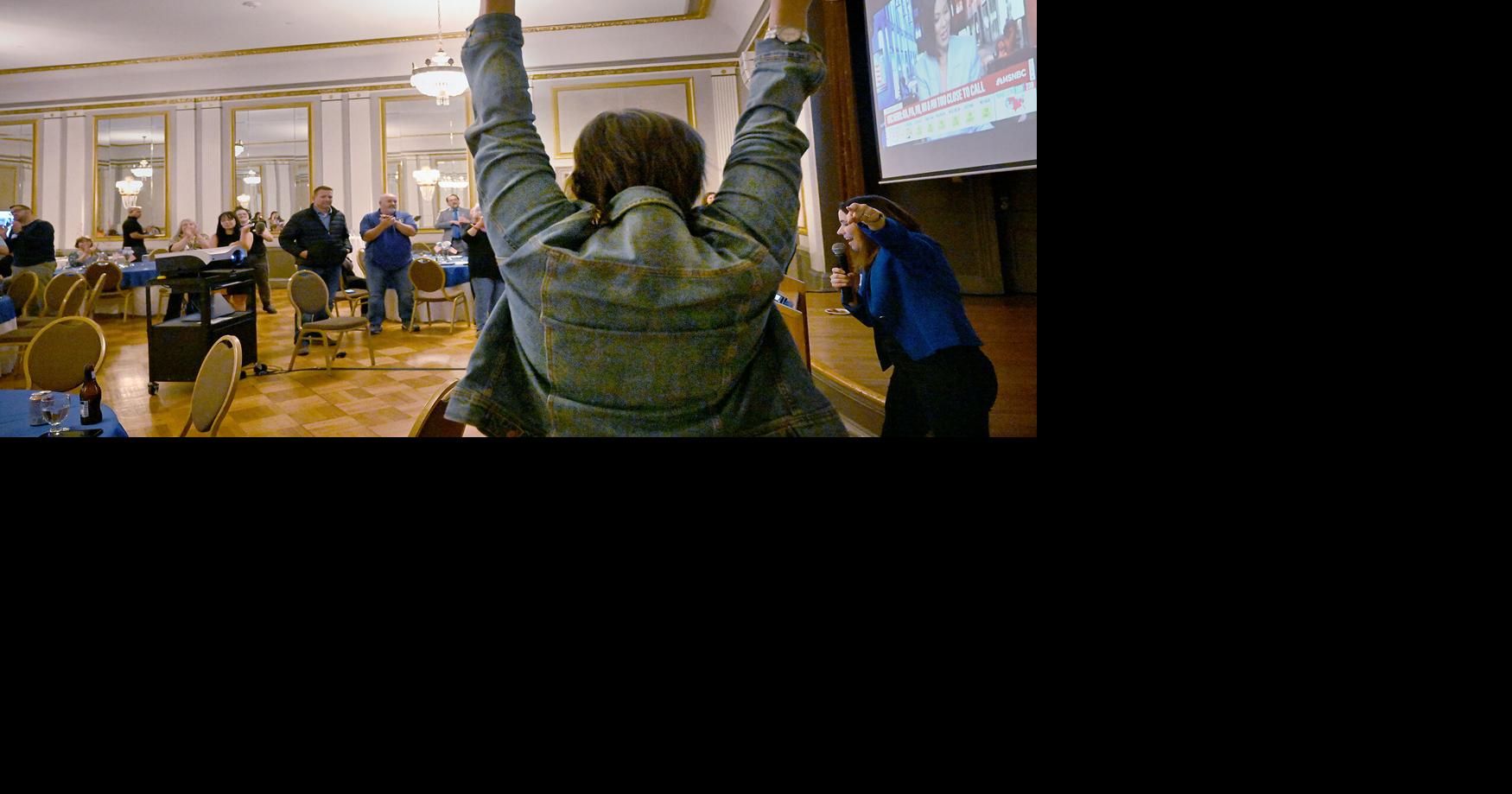 Stephanie Morrell raises her arms in victory as her seat as the ...