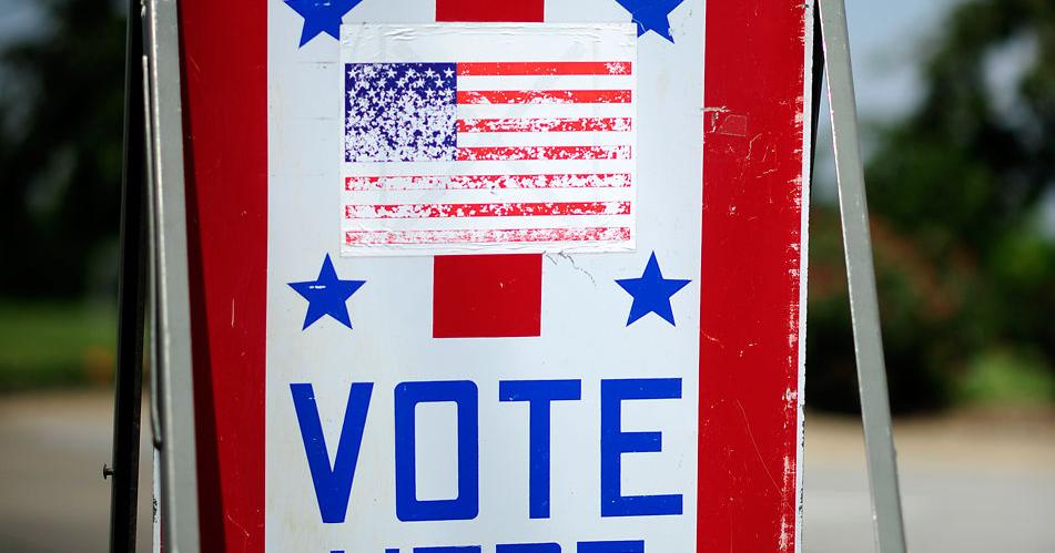 A faded U.S. flag adorns a voting sign | Visuals | columbiamissourian.com