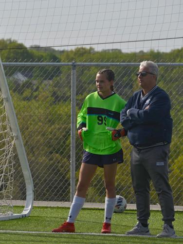 Tolton girls soccer coach Chuck Register talks to his varsity player ...