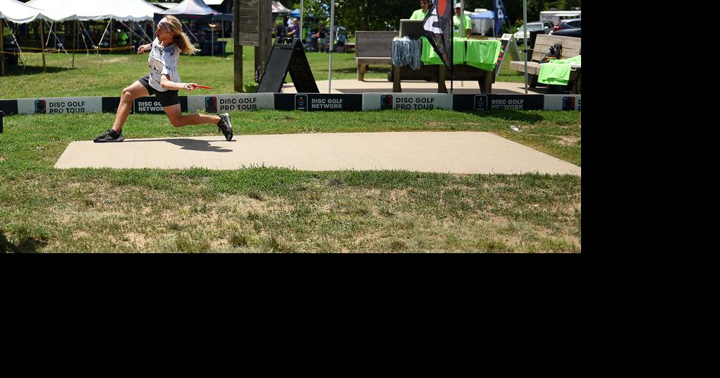 Disc golfers compete during the first round of the Mid America Open ...