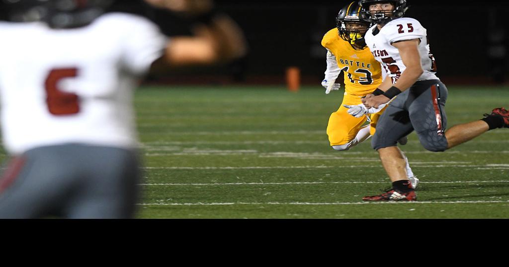 Daniel Dickerson and Danny Ayers watch as the Jackson quarterback ...