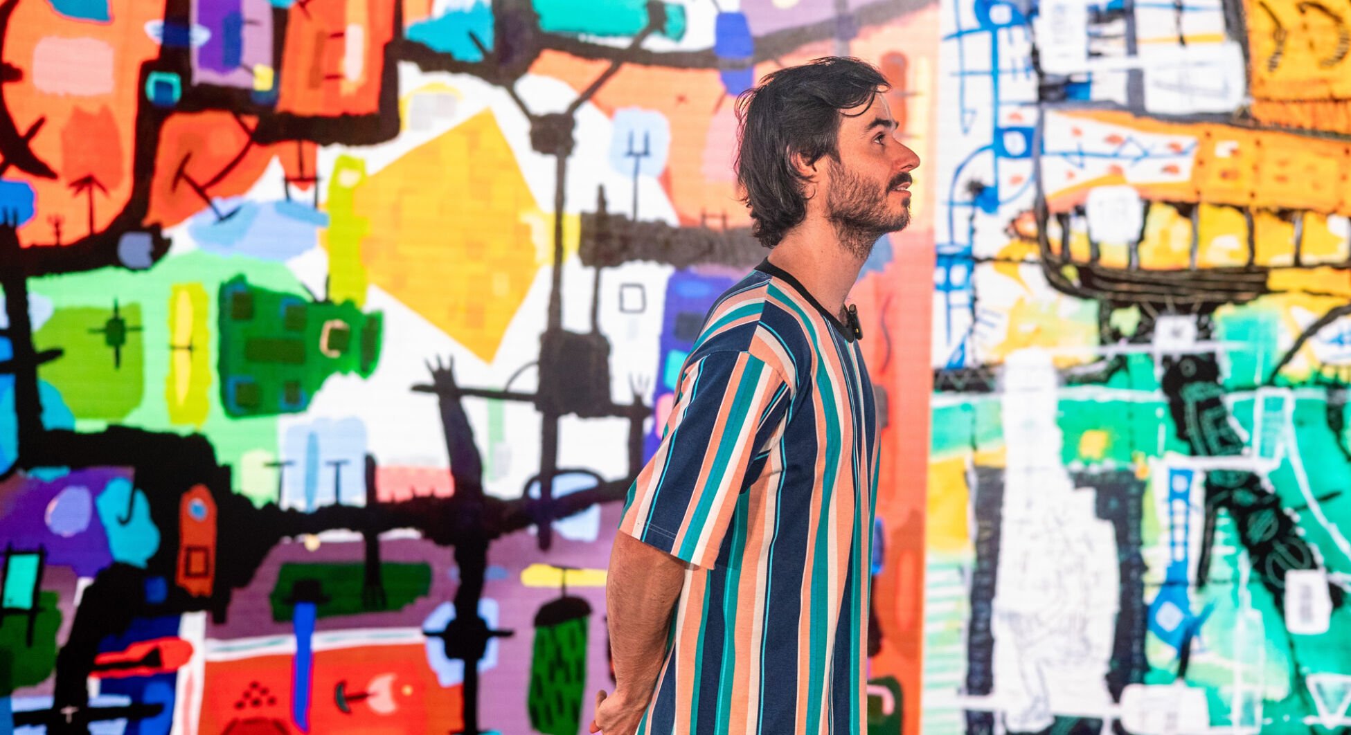 recent photo of Sam in front of his art mid show - photographer Sarah ...