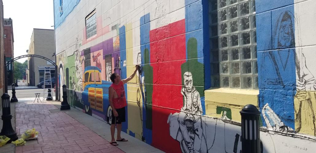 Local artist hard at work on alley mural | Local News | crescent-news.com
