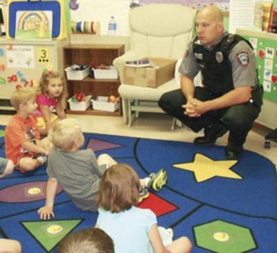 Defiance City Police patrolman Chris Yocum talks about safety with ...