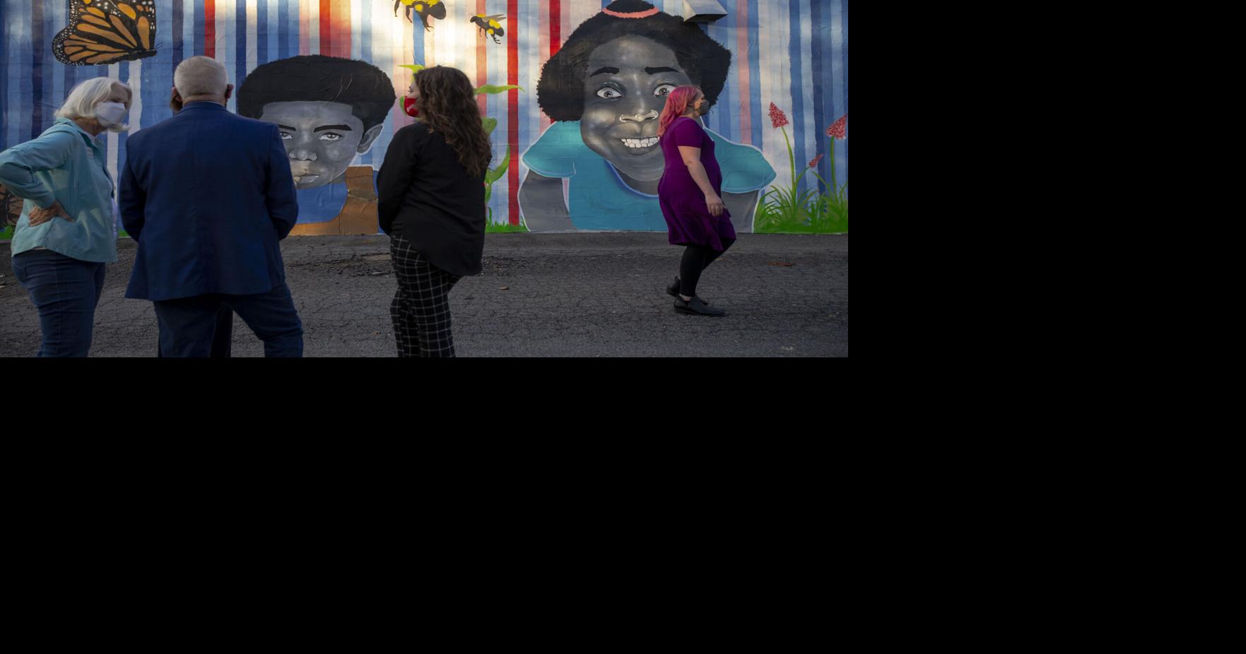A climate justice mural is unveiled