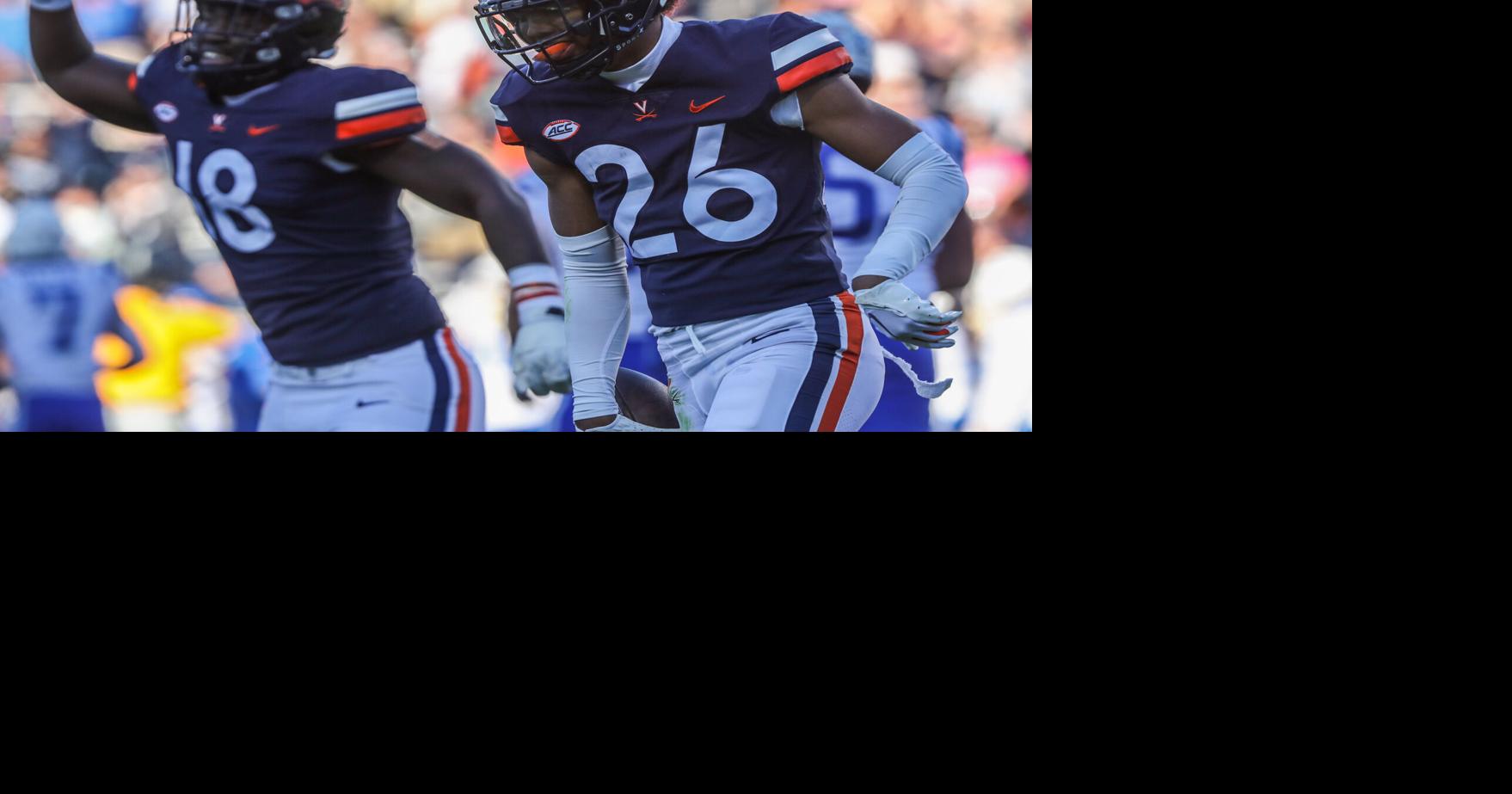 Virginia safeties Jonas Sanker, Tayvonn Kyle and Caleb Hardy playing ...