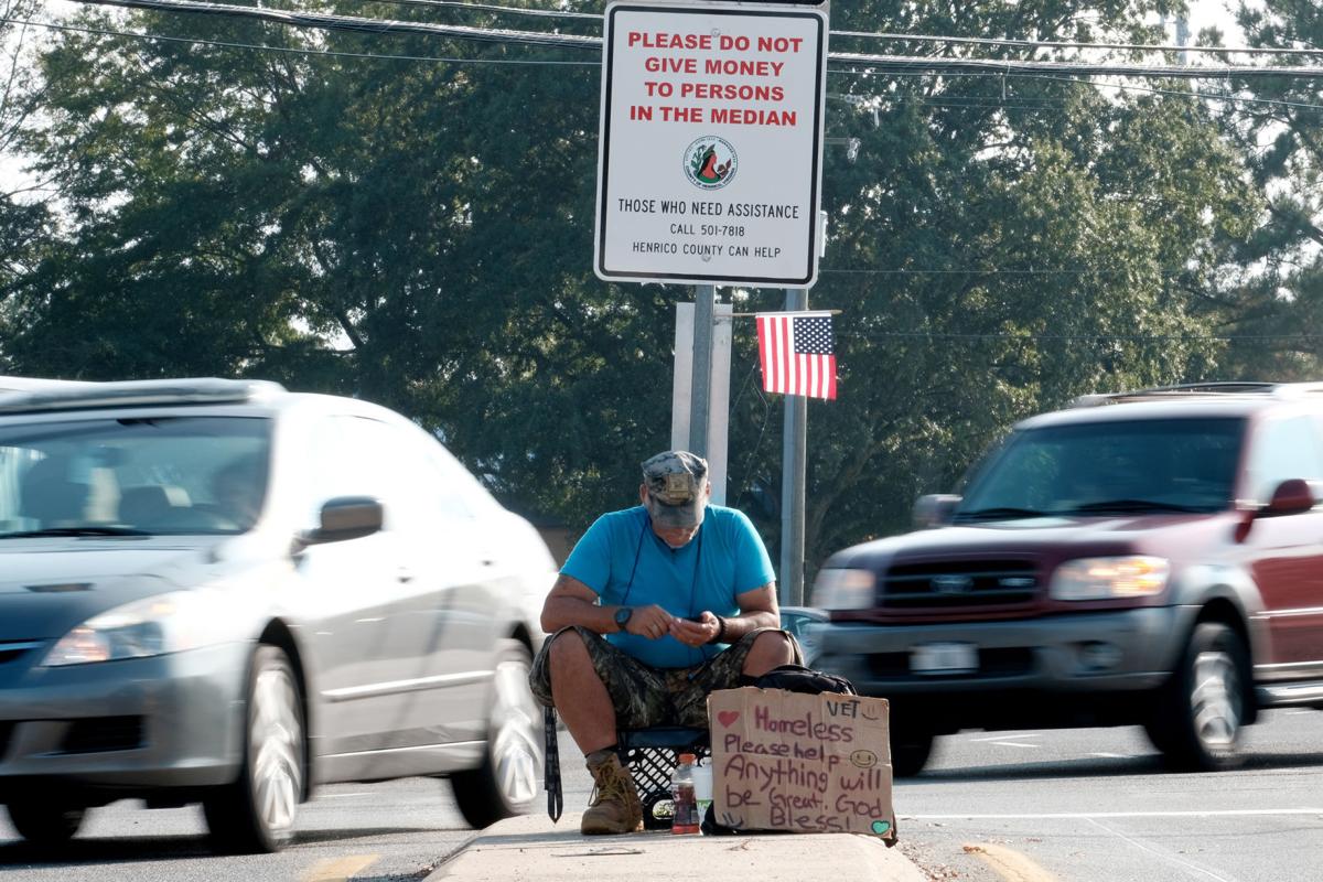 To discourage panhandling, a Virginia county puts up signs at busy ...