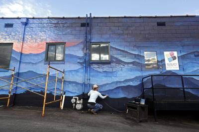 New-to-town muralist making her mark on Harris Street