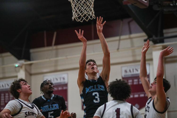 Photos: St. Anne's-Belfield boys basketball team hosts Miller School