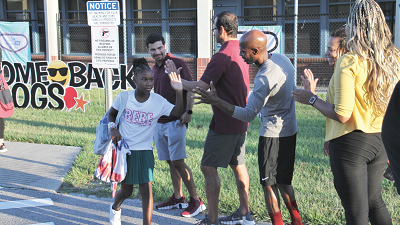 Cheers and high fives greet students on first day of school | Education ...
