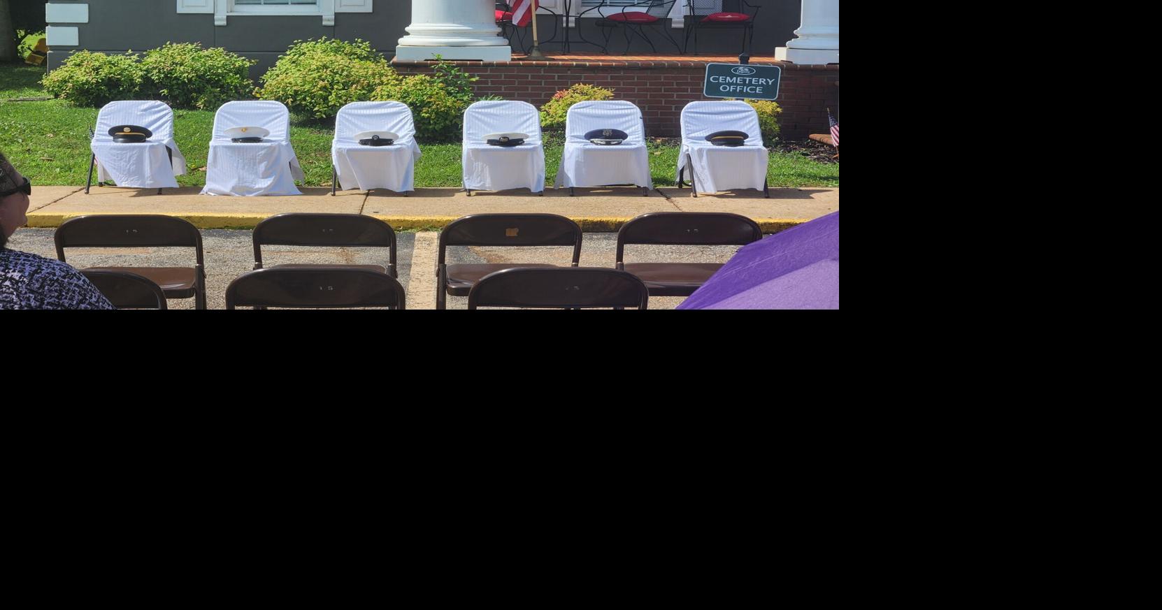 Six empty chairs representing branches of military at Roselawn cemetery ...