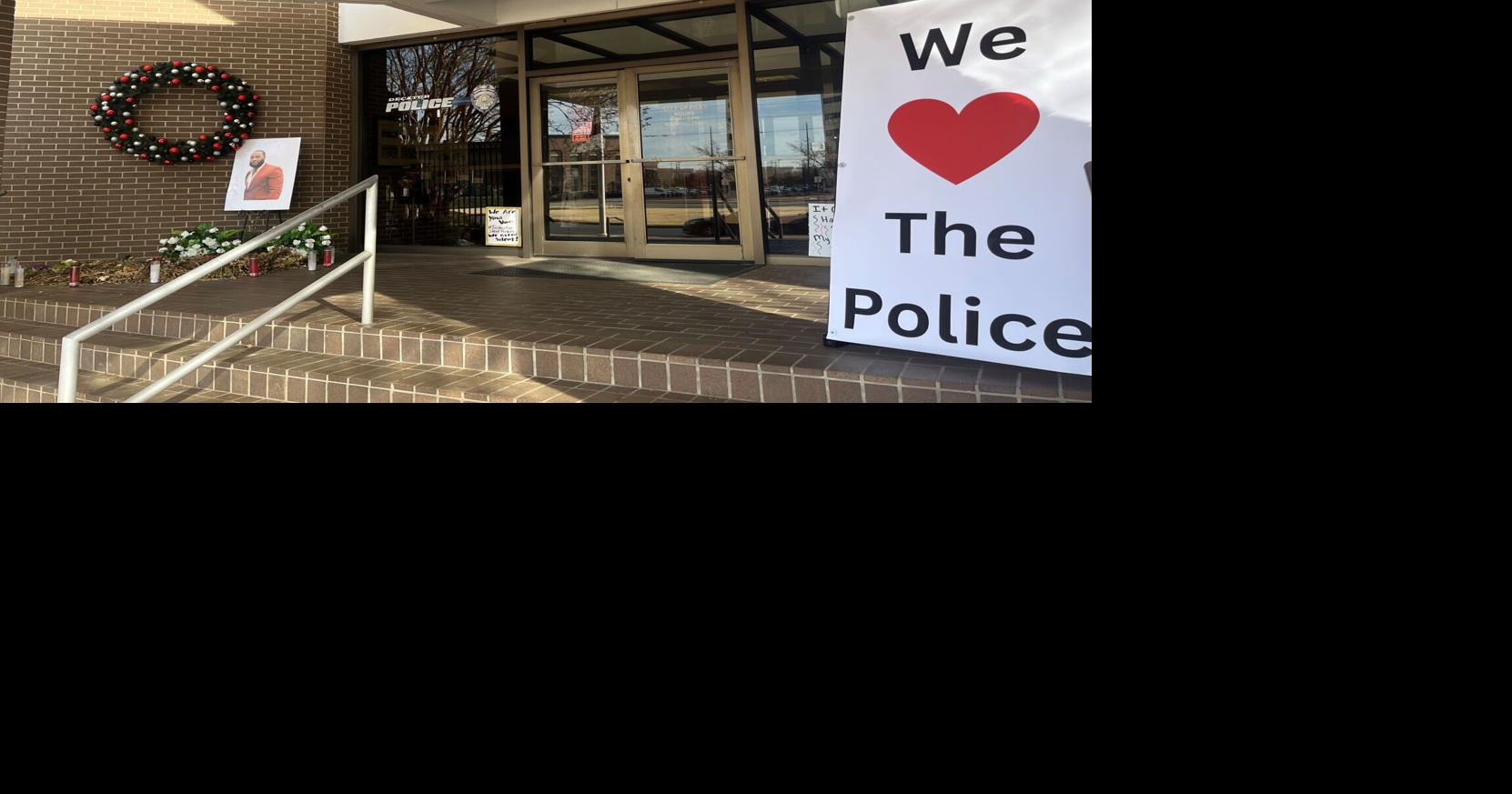 Pro-police signs appear alongside Perkins memorial at City Hall ...