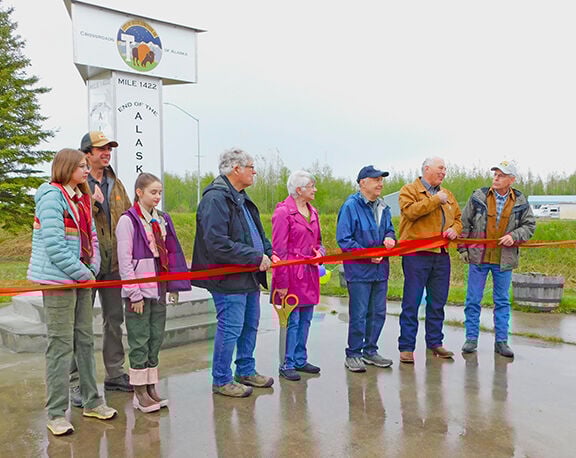 Dedication of the new Visitor Center’s Milepost sign marks the official end of the Alaska ...