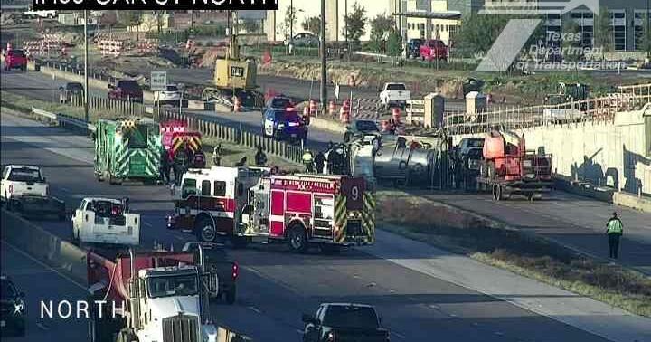Rolled semi blocks northbound I-35 service lanes at Scripture Street ...