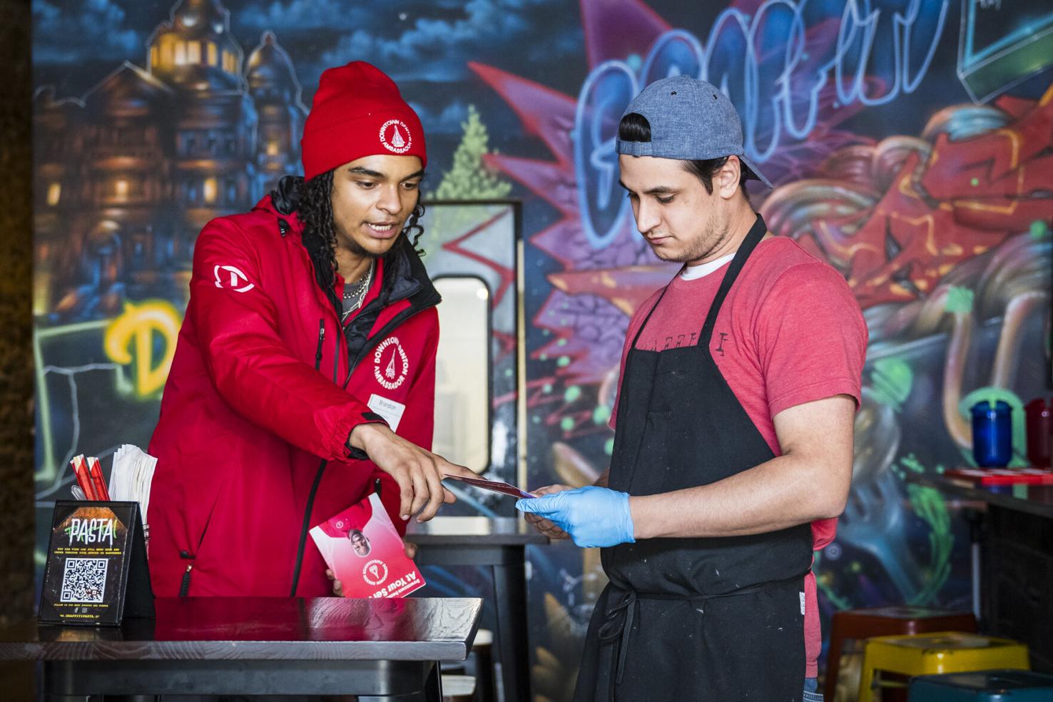 The red shirts are helpers on the Square: Denton's new $708K ambassador ...