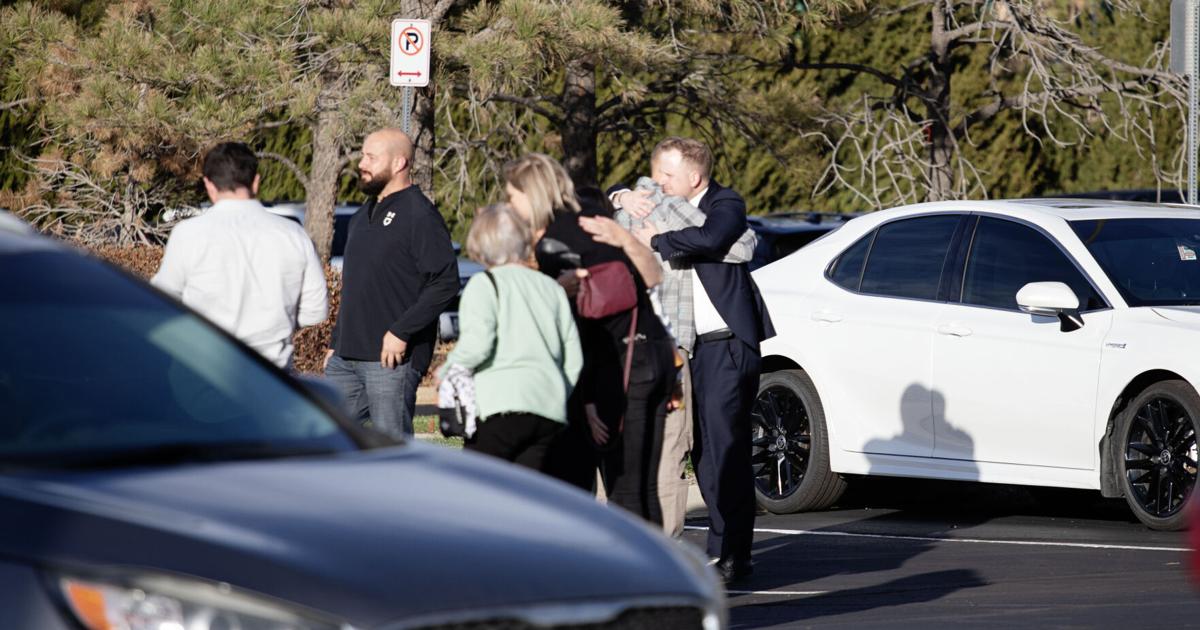 Aurora Police Officer Nathan Woodyard Embraces People Gathered After