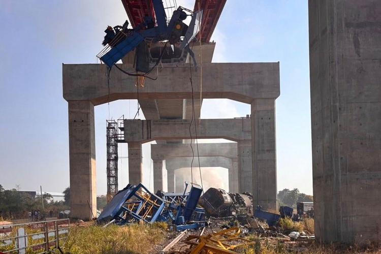 A construction crane falls onto a moving train in Thailand, killing at ...
