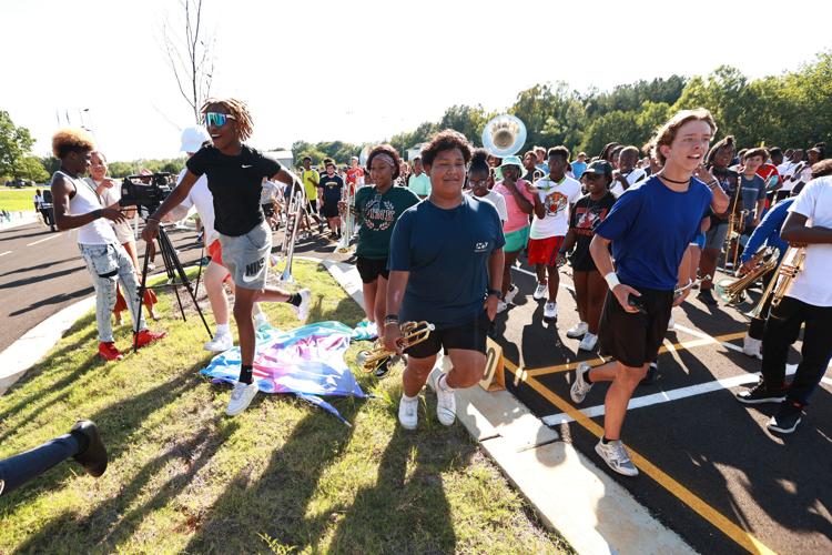 Tupelo High School band students surprised with new trailer wraps ...