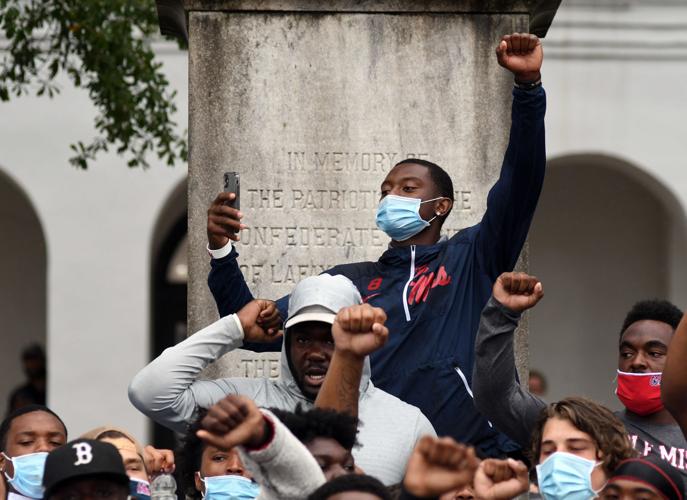 PHOTOS: Ole Miss football marches on the square | Sports | djournal.com