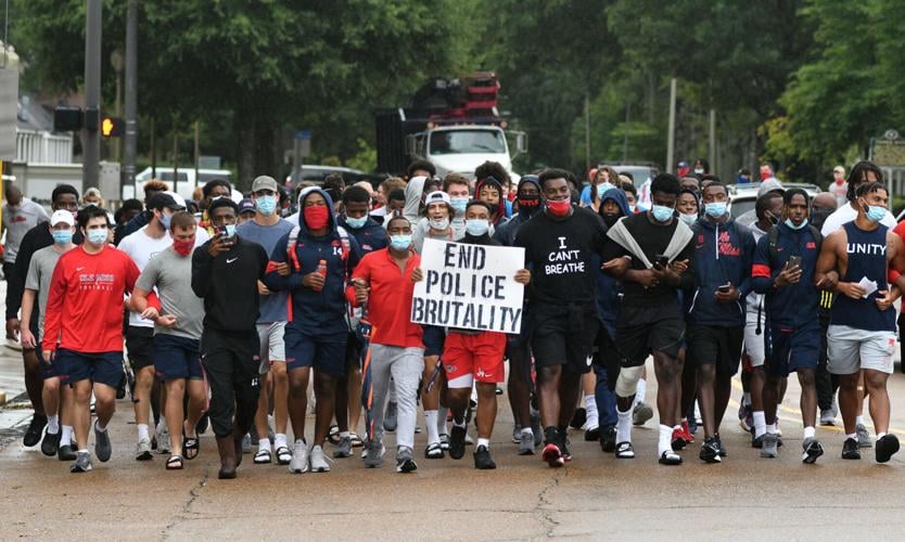 PHOTOS: Ole Miss football marches on the square | Sports | djournal.com