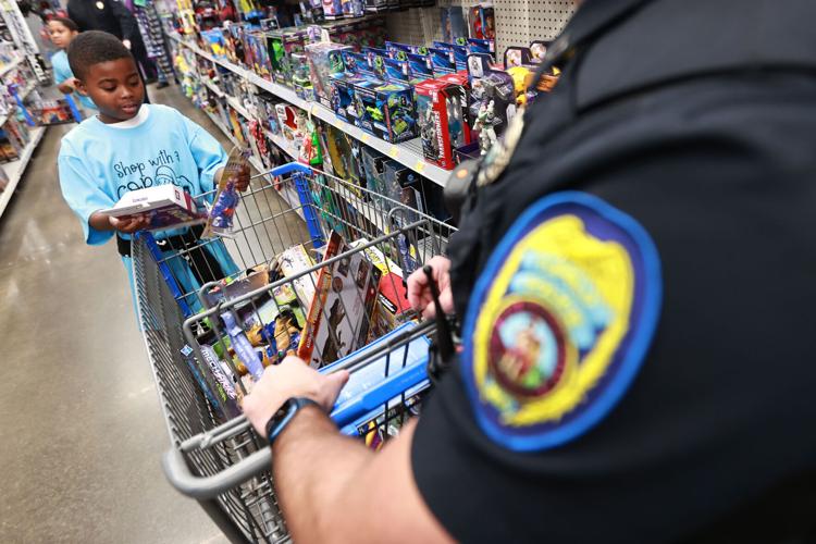 Shop with a Cop: Students and Tupelo cops go on Christmas shopping ...