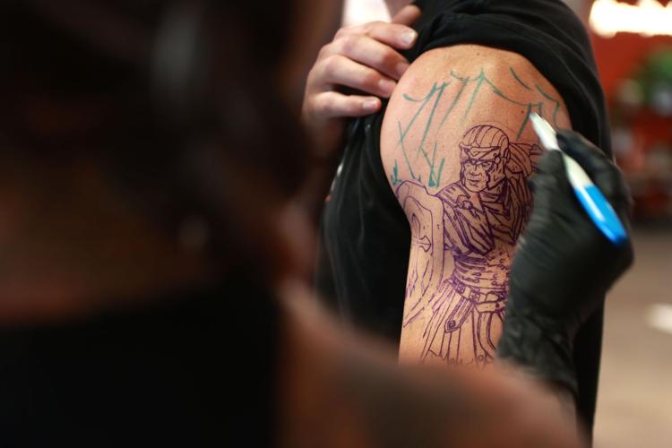 Tattoo artist, shop owner helps tell stories through skin and ink ...