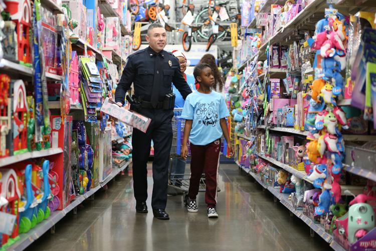 Shop with a Cop: Students and Tupelo cops go on Christmas shopping ...