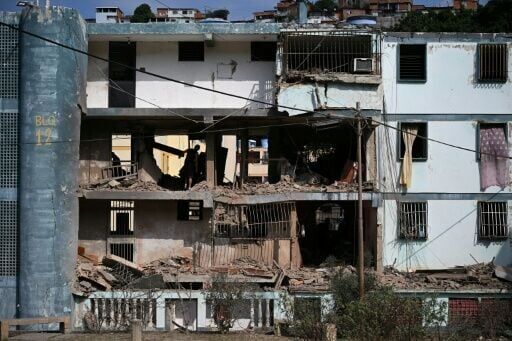 Clearing bomb wreckage, Venezuelan mourns aunt killed in US raid | News ...