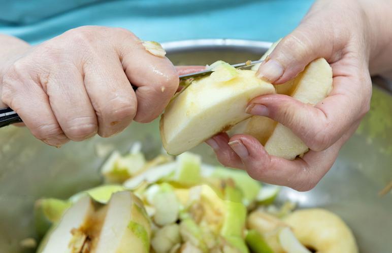 Stirring up tradition: Edinburg church gathers each year to make apple ...