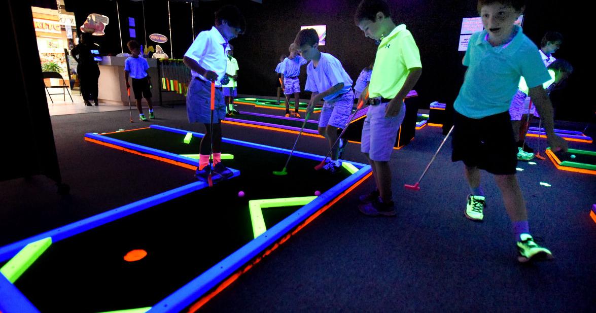 Miniature black light golf course now open in Dothan mall