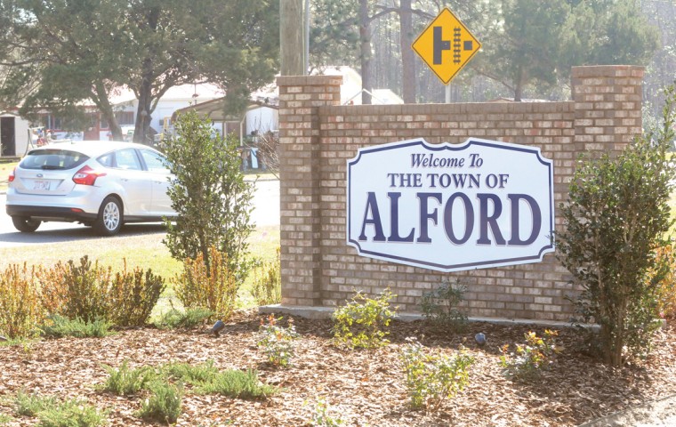 Signs welcome visitors to Alford