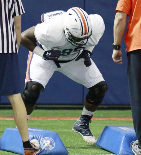 Auburn DT Dontavius Russell making transition from 'plugger' to playmaker