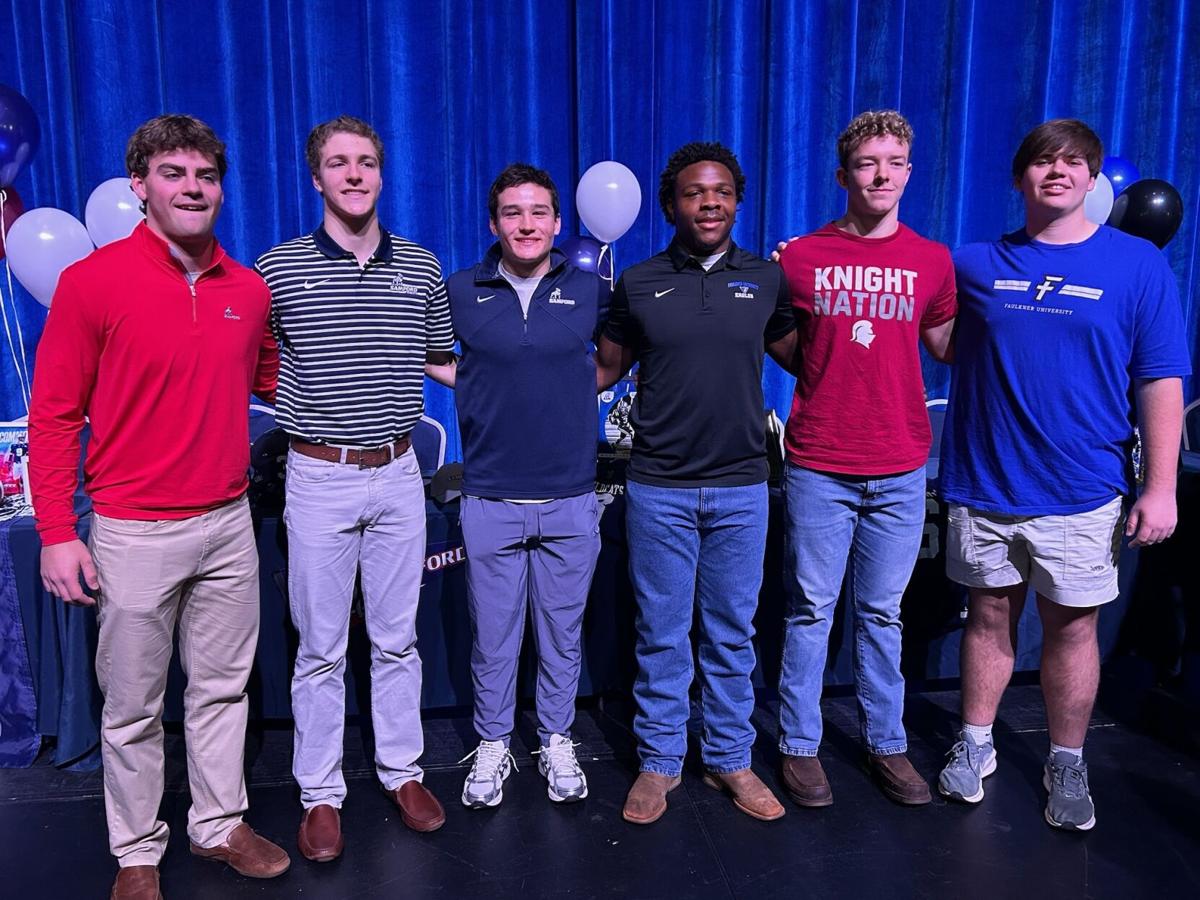 Wildcat football players sign with colleges during ceremony