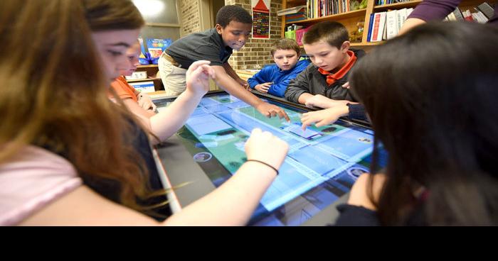 Heard Magnet students using ActivTable to build technology, teamwork skills