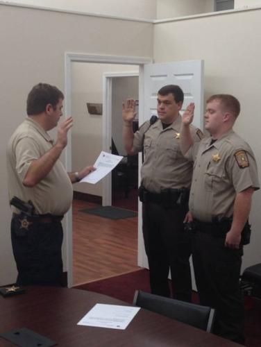 Dale County Sheriff Wally Olson swears in two new deputies