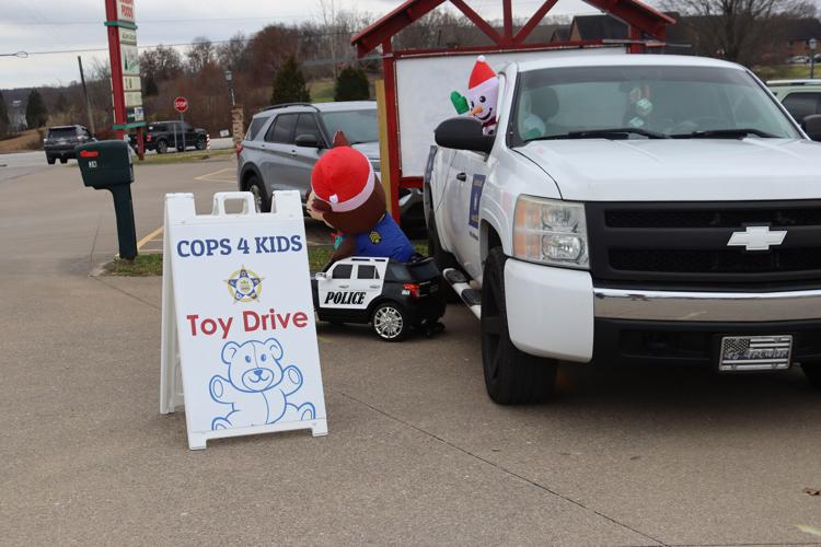 The cops help supply toys for children | Spencer County News ...